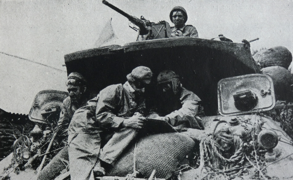 Crew of M10 Tank Destroyer consulting map