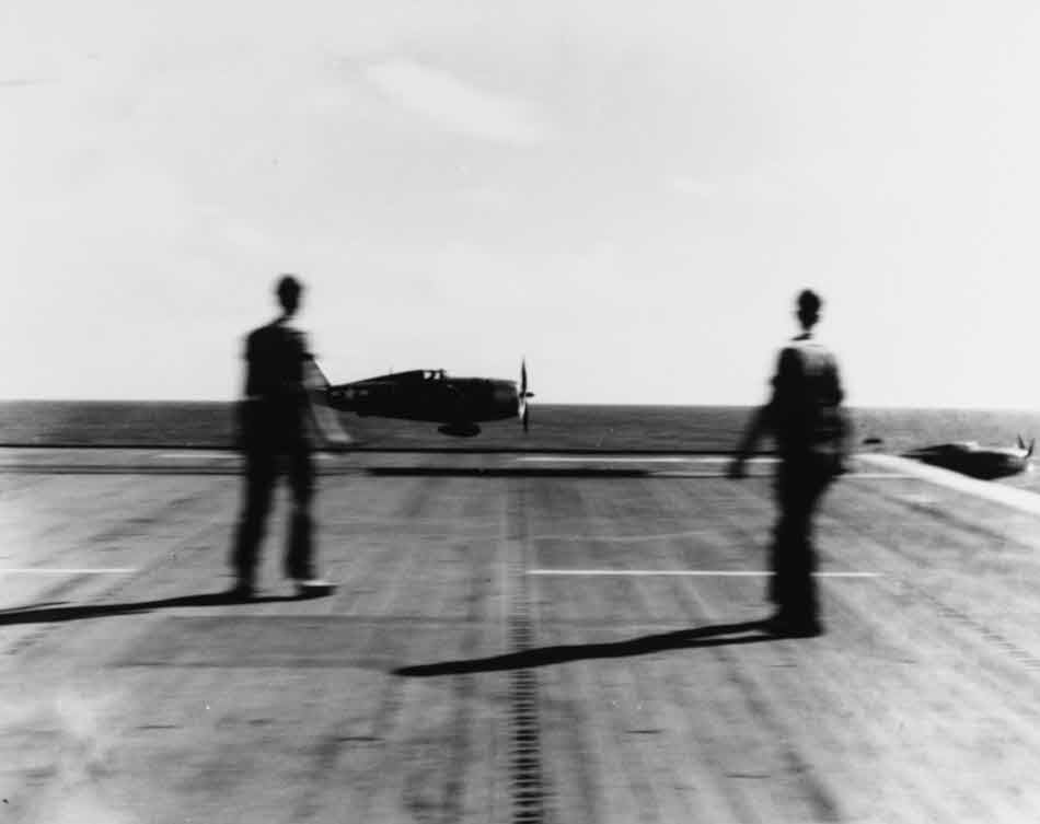 P-47s buzz USS Natoma Bay (CVE-62)